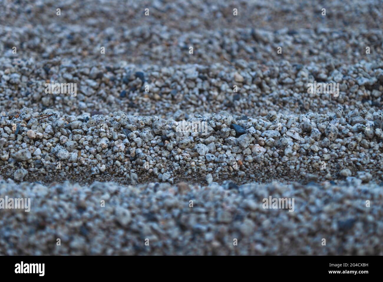 Detail of lines in a zen garden with typical simple raked gravel in ...