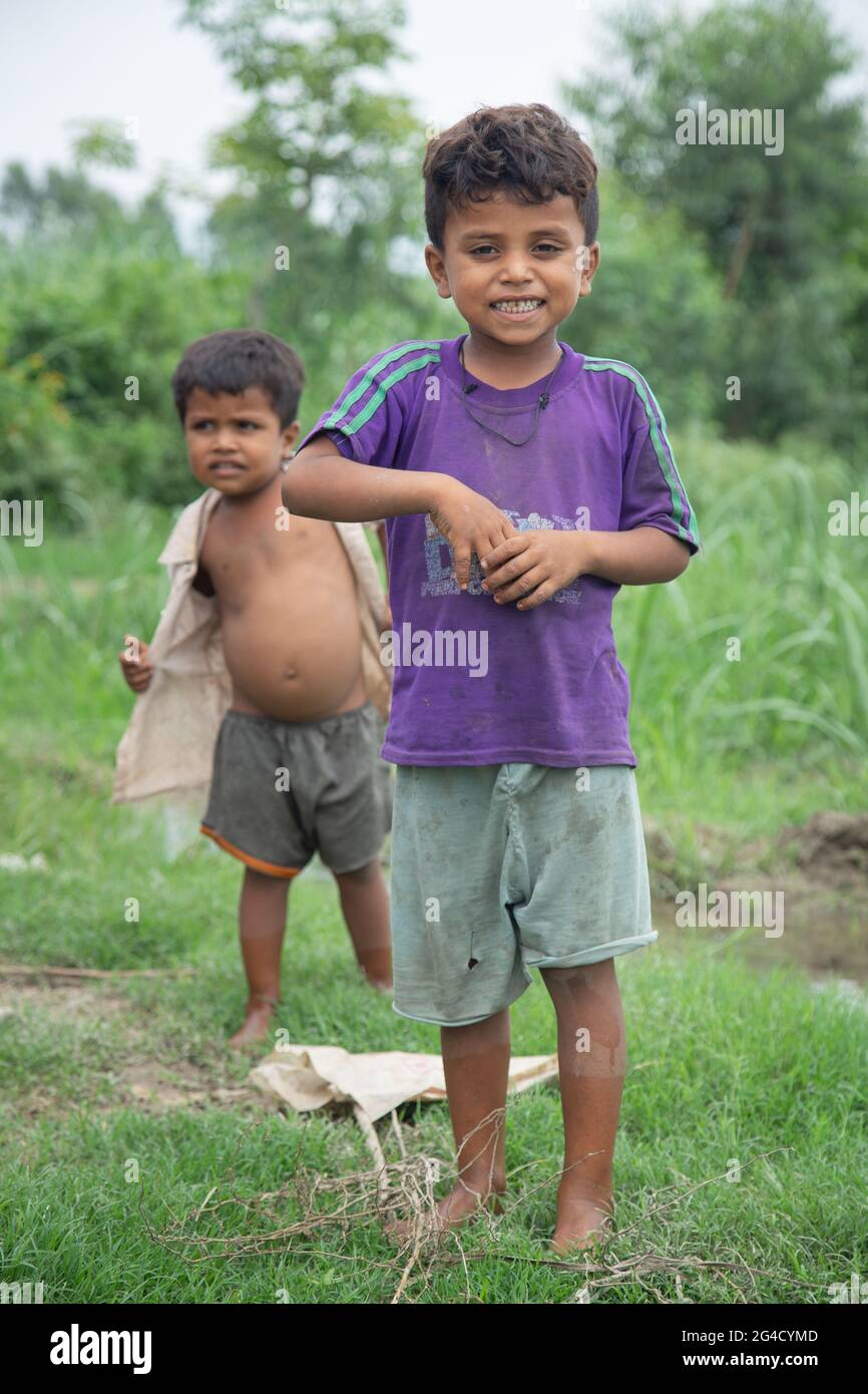 Portrait of two poor Indian children standing Stock Photo - Alamy