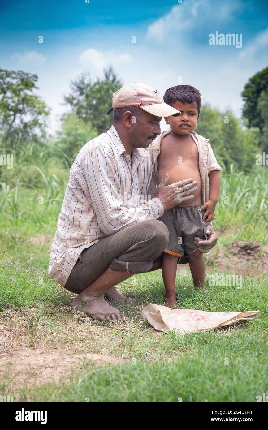 Real people from rural India: Happy father and son. Indian farmer with ...