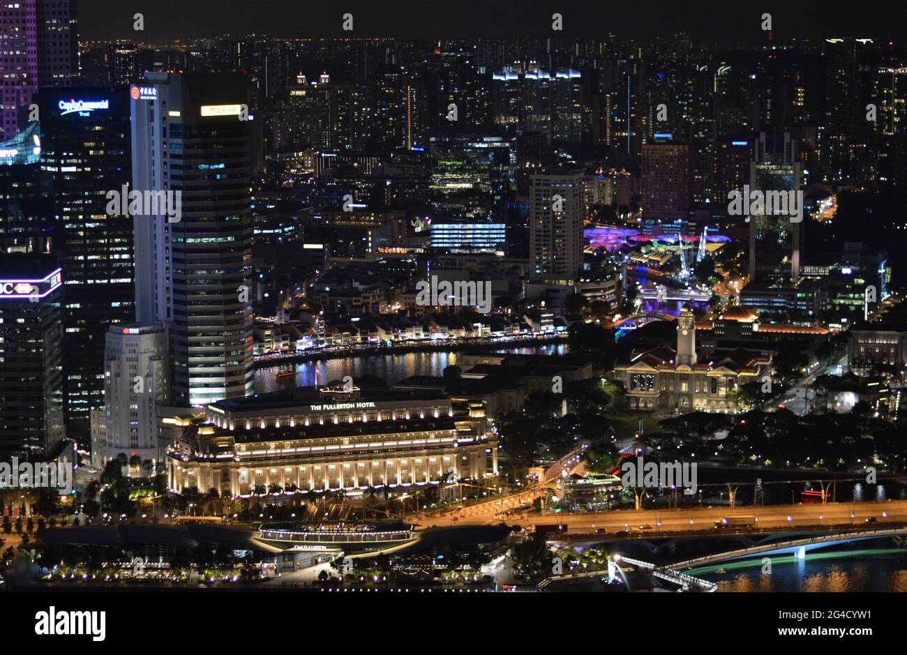 Singapore Skyscraper at night, view from a rooftop bar at Marina Bay ...