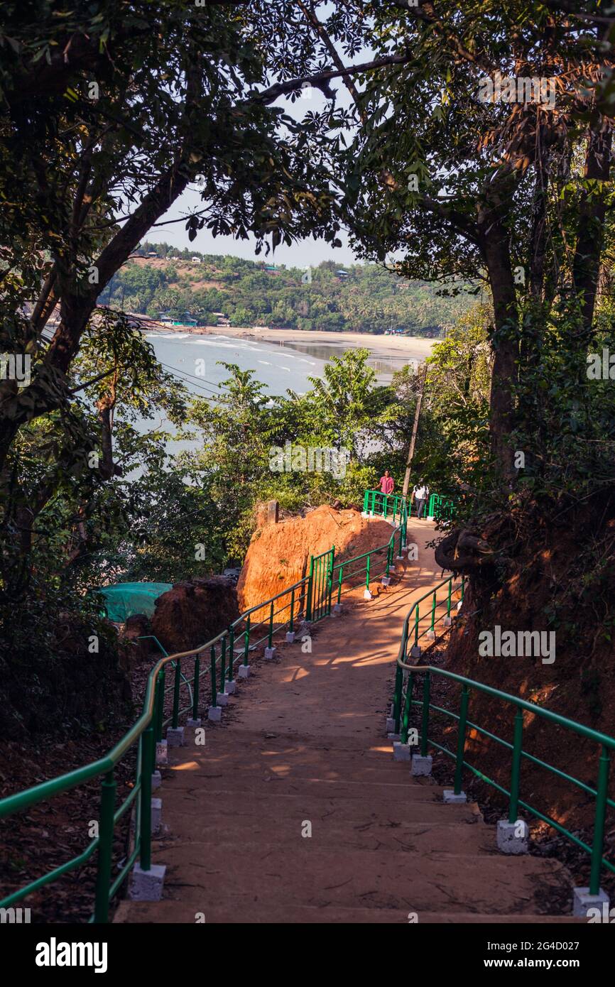 View from the staircase down to the vast sandy desolate beach at Kudle ...