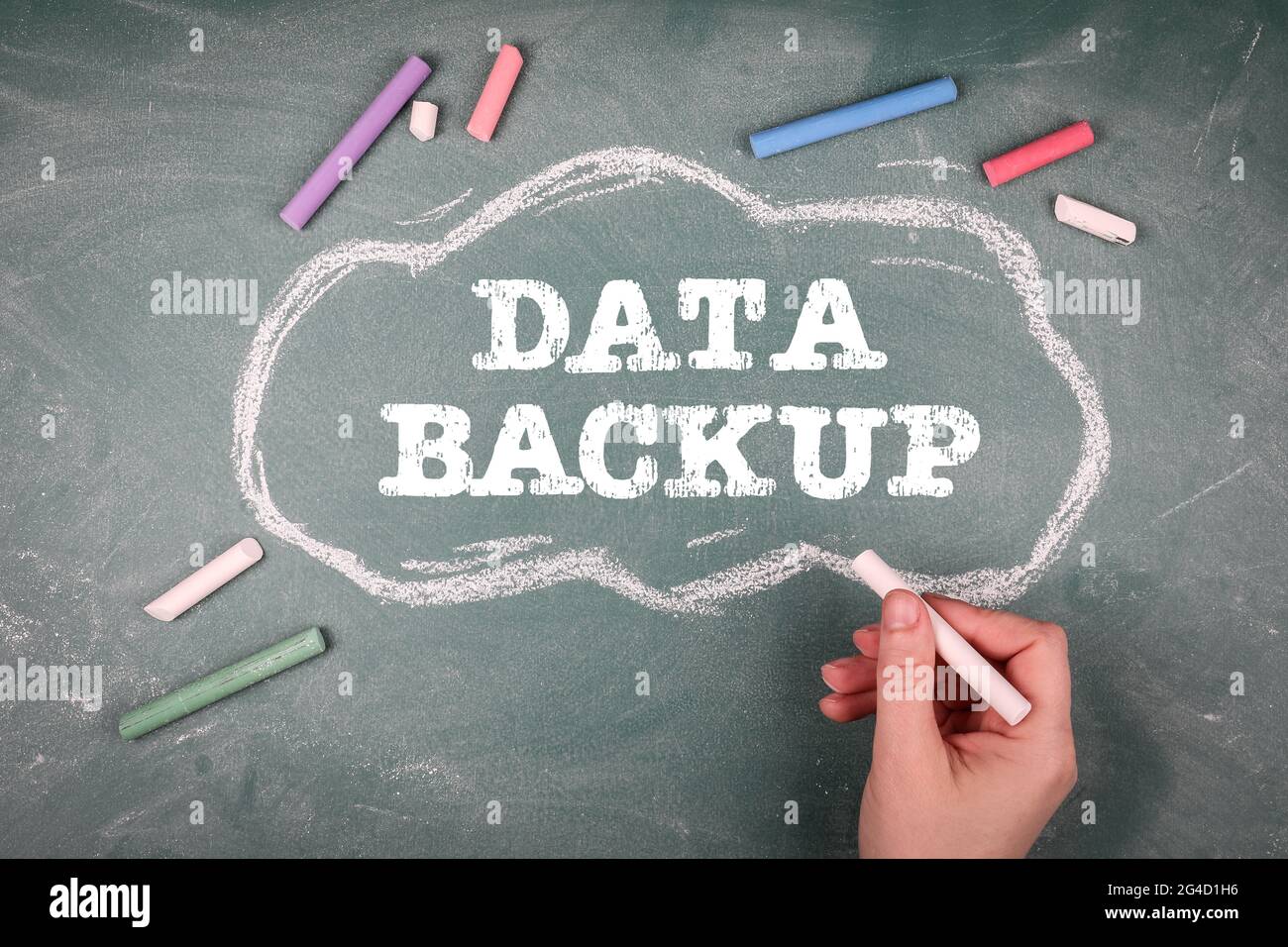 Data Backup. Cloud and colored pieces of chalk on a green chalkboard ...