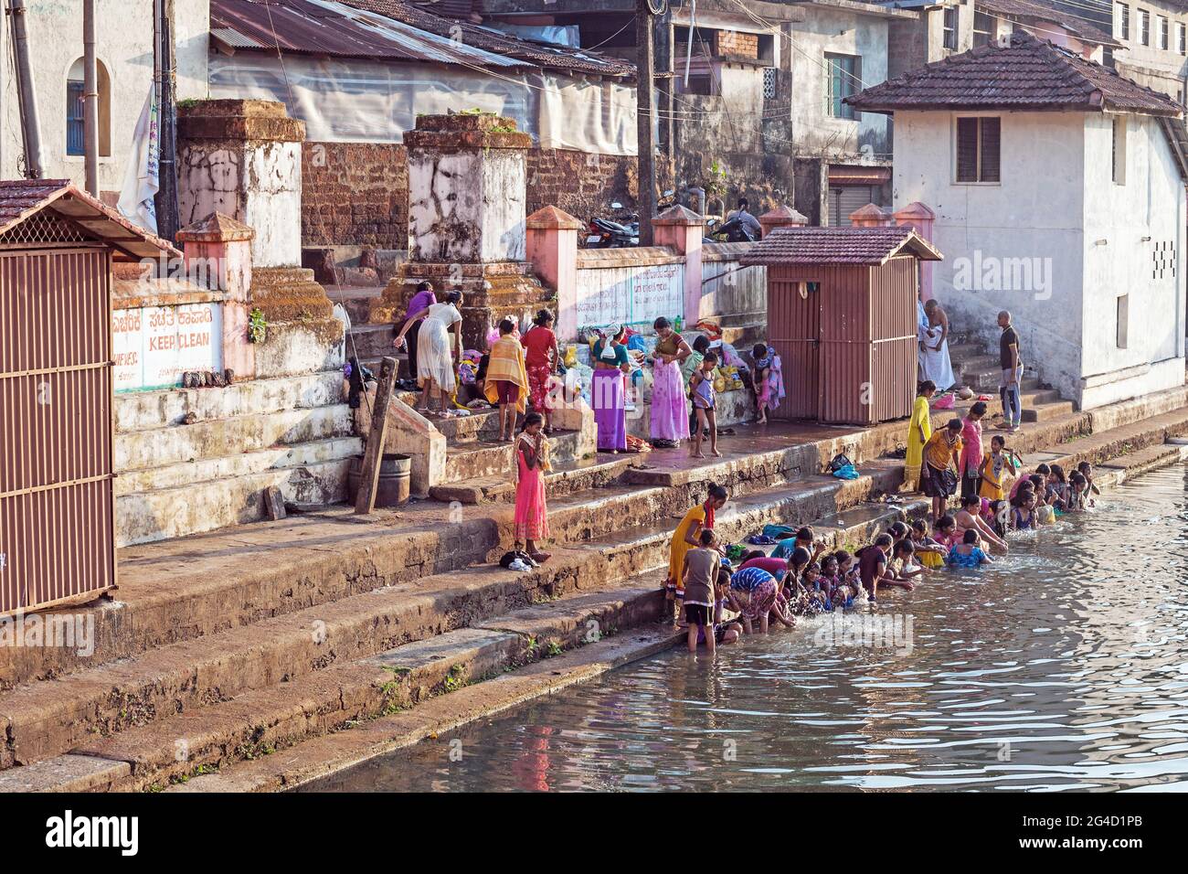 Indian worshippers performing their daily ablutions at the spiritual ...