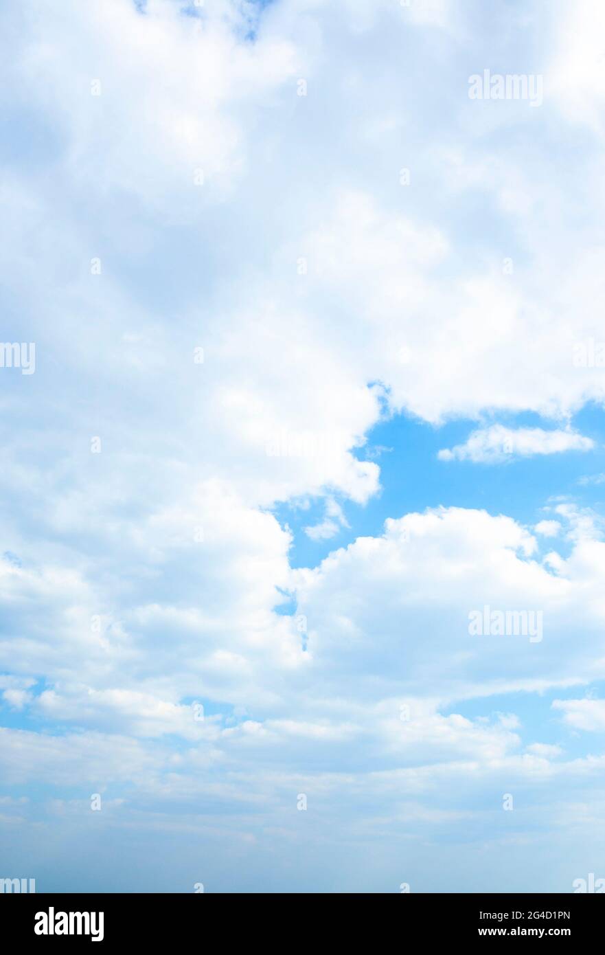 Huge clouds in blue sky lit by the sun, not windy Stock Photo - Alamy