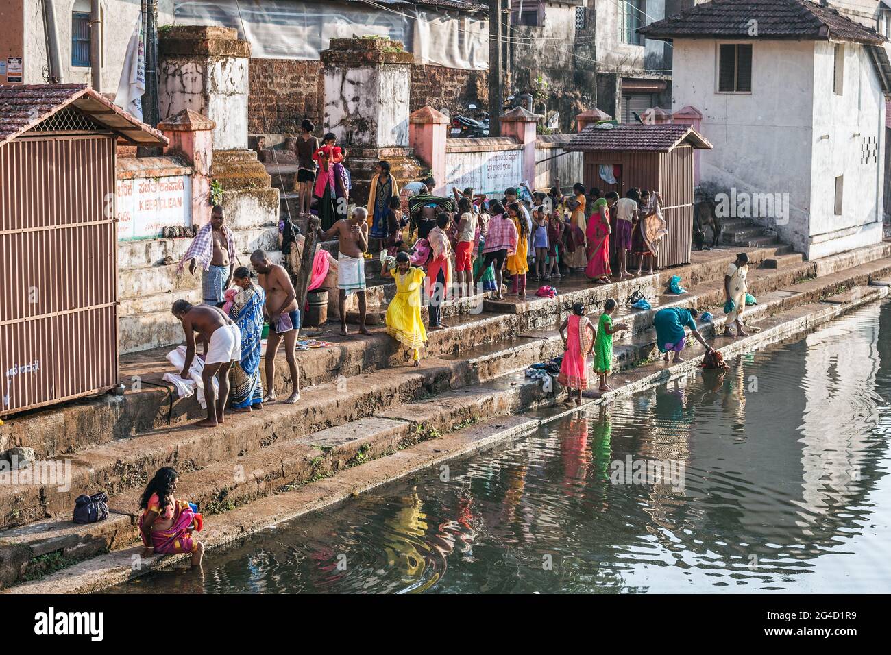 Indian worshippers performing their daily ablutions at the spiritual ...