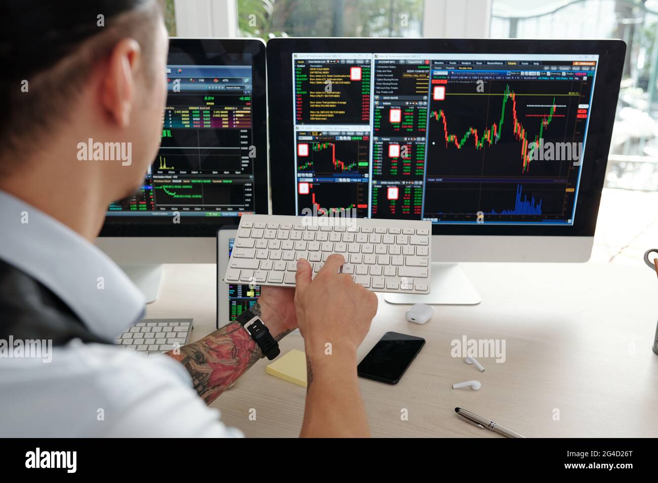 Stockbroker buying and selling shares on behalf of clients, he is ...