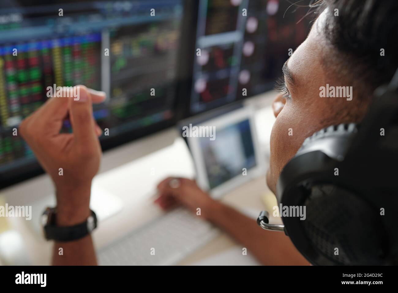 Close Up Image Of Trader In Headphones Alayzing Stock Market Data On