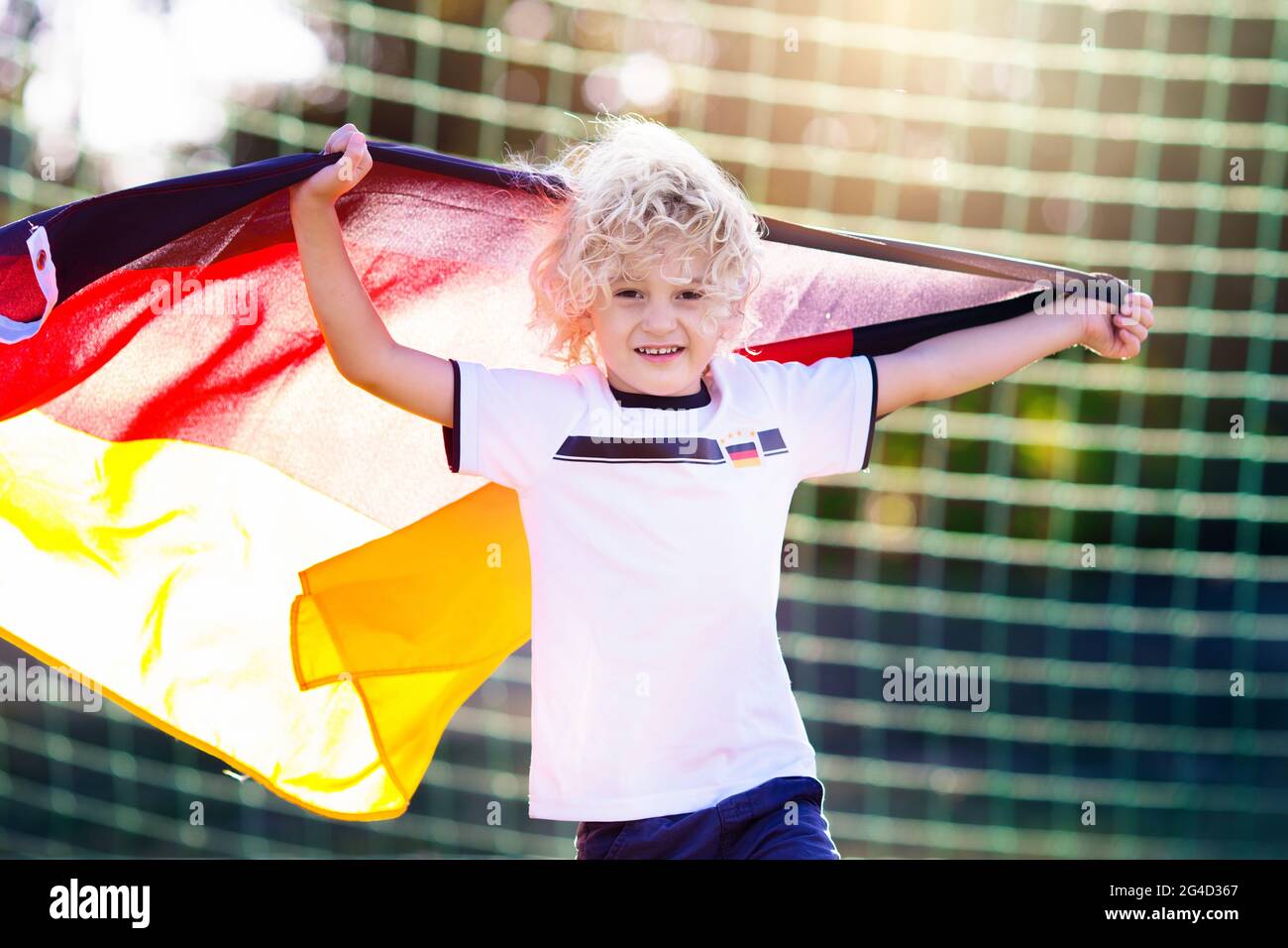 Child playing football in stadium hi-res stock photography and images ...