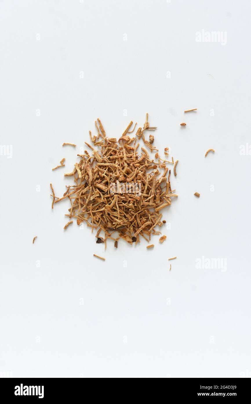 Dried ginseng root on isolated white background Stock Photo - Alamy
