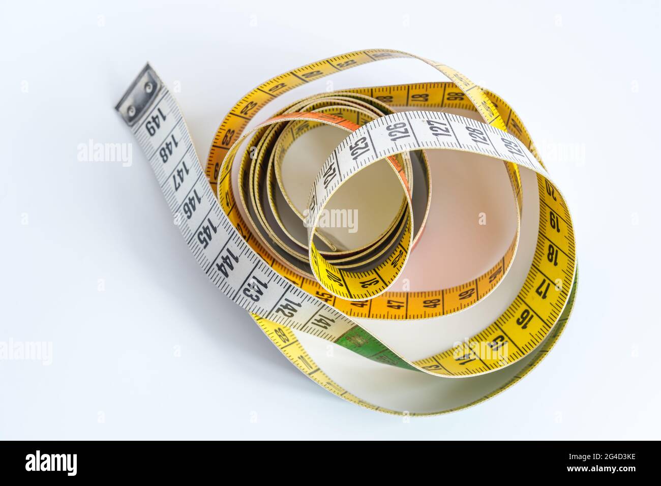 Measuring tape of the tailor on white Stock Photo - Alamy