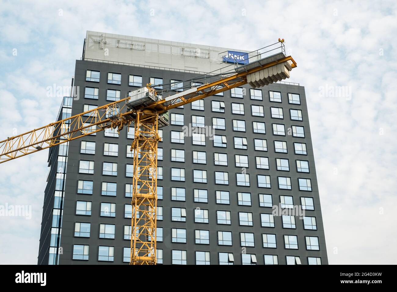 crane with modern building in the back Stock Photo - Alamy