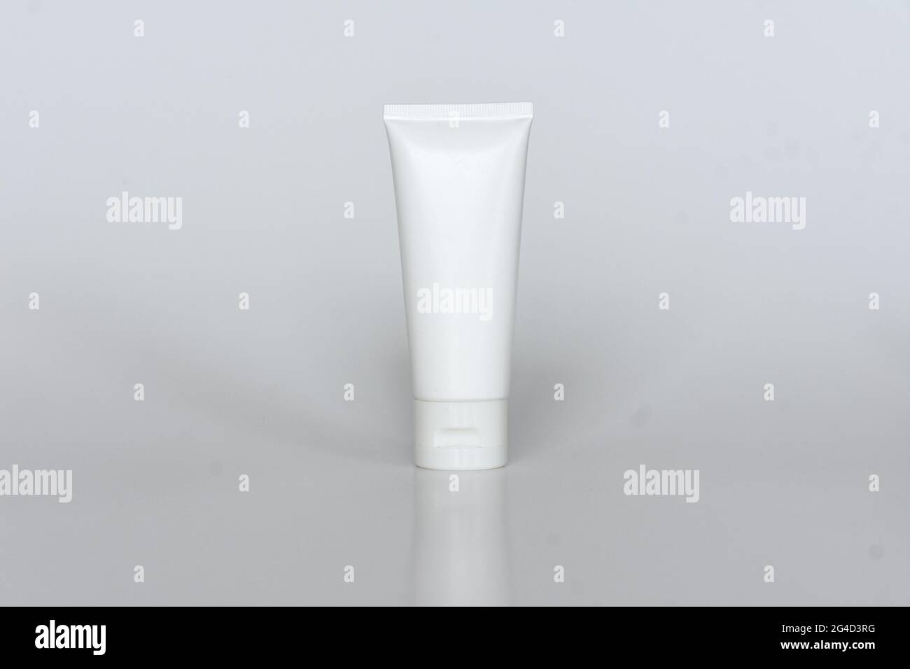 White plastic cosmetic tube container on isolated white background ...
