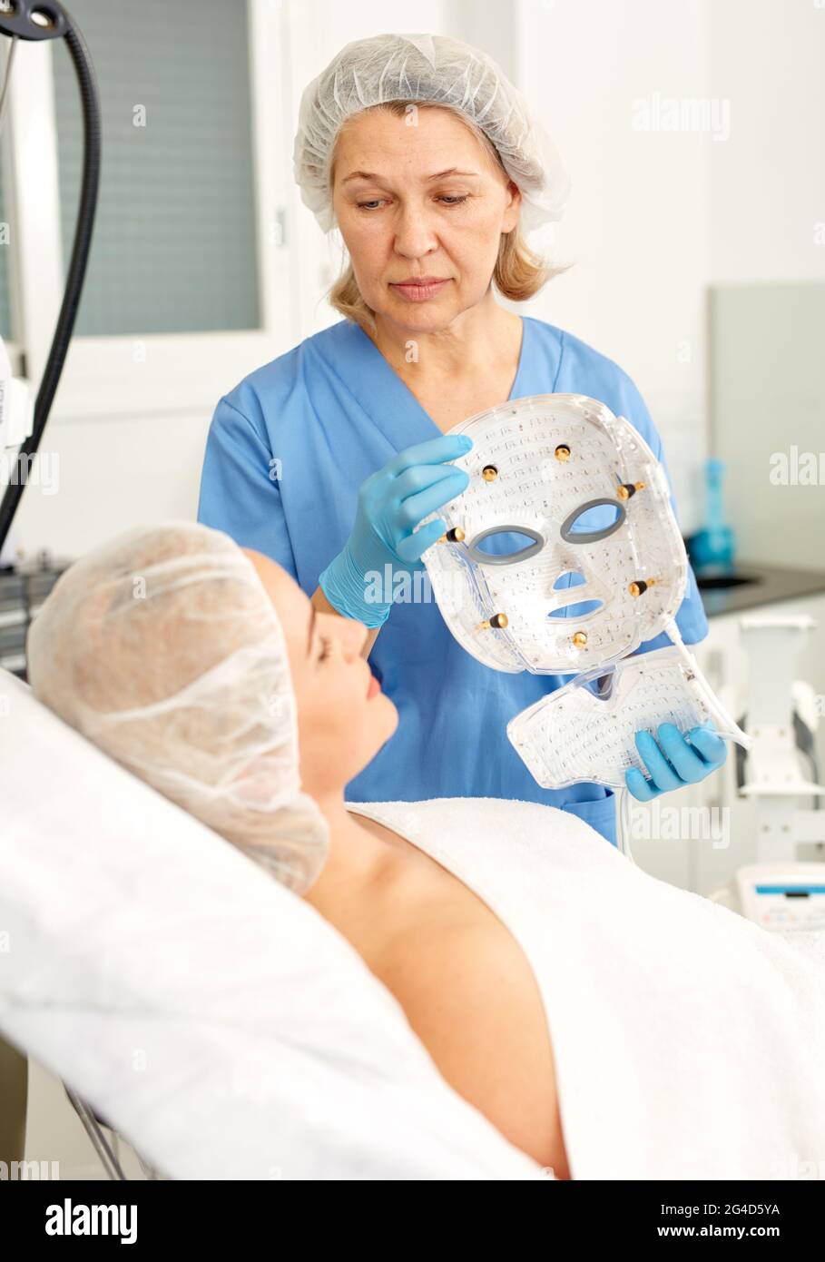 Conducting facial rejuvenation medical procedure using a mask with ...