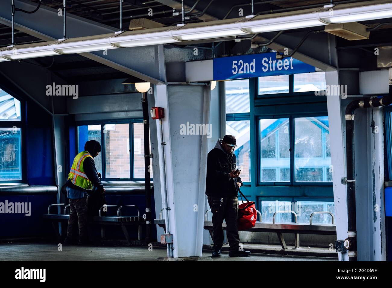 Man waiting for train at subway station Stock Photo - Alamy