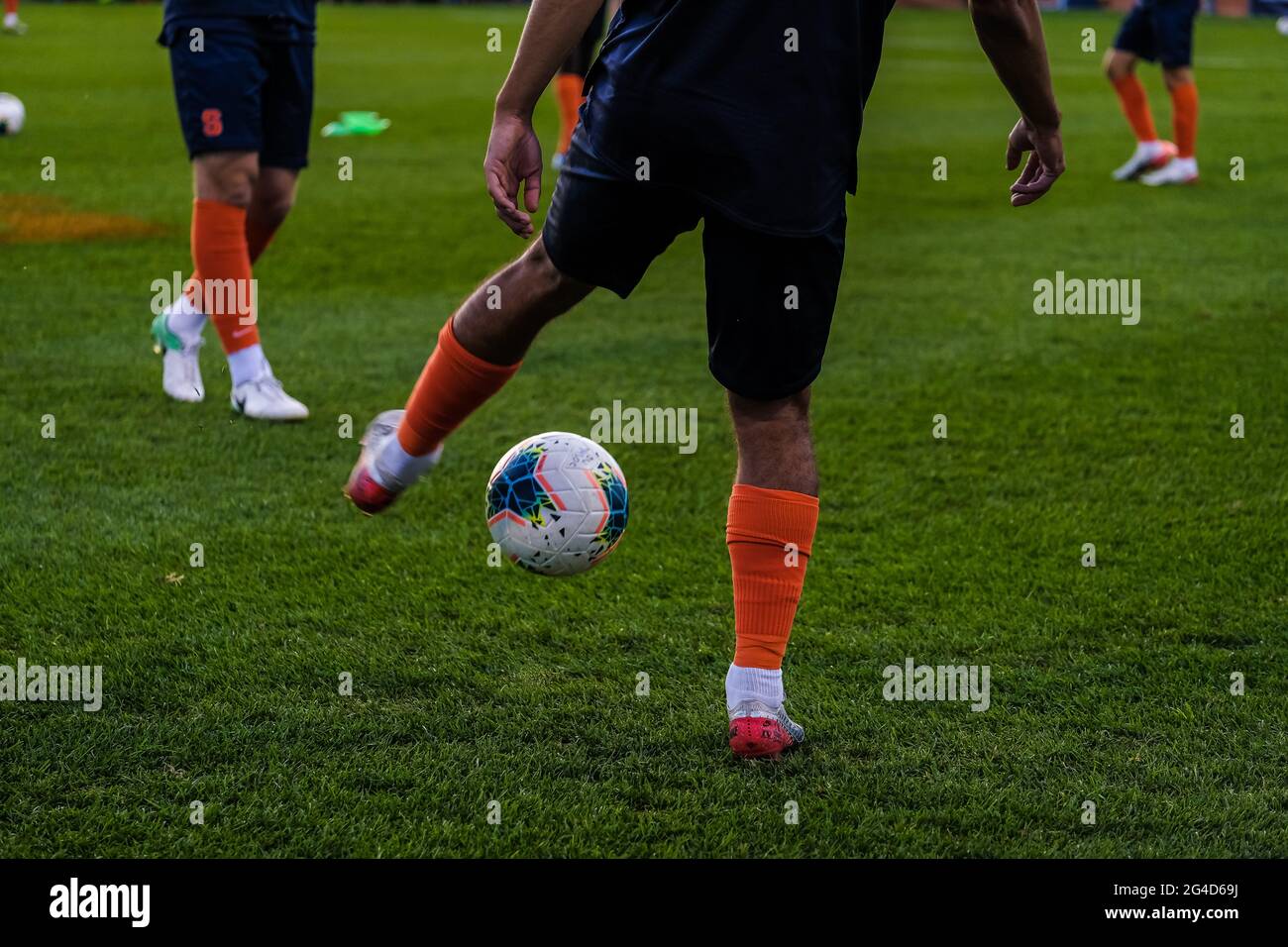 Soccer player juggling a ball Stock Photo - Alamy