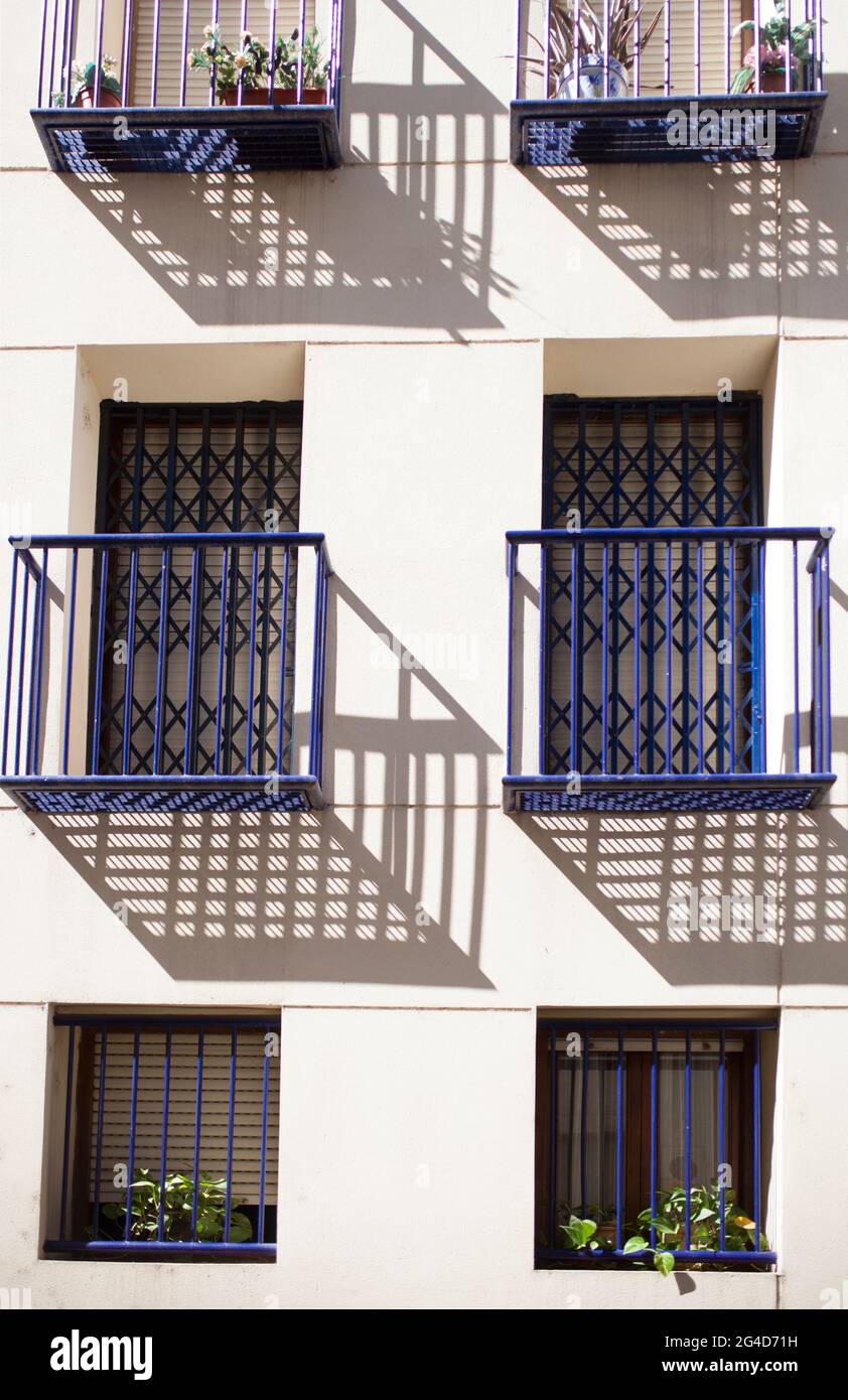 Seville blue painted balconies street overlook the narrow streets of ...