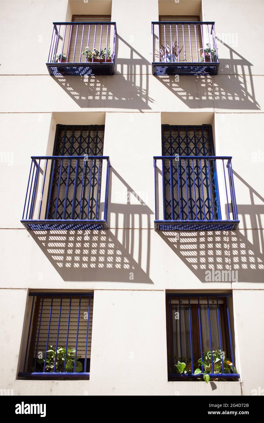 Seville blue painted balconies street overlook the narrow streets of ...