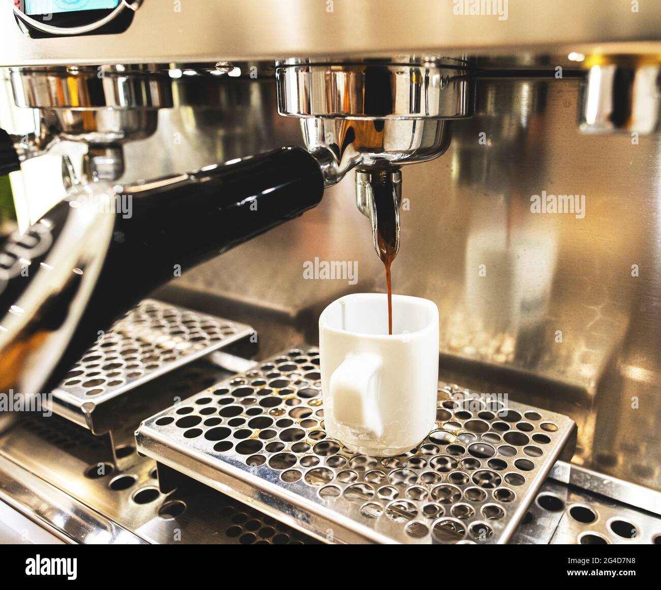 Professional coffee machine pouring espresso hi-res stock photography ...