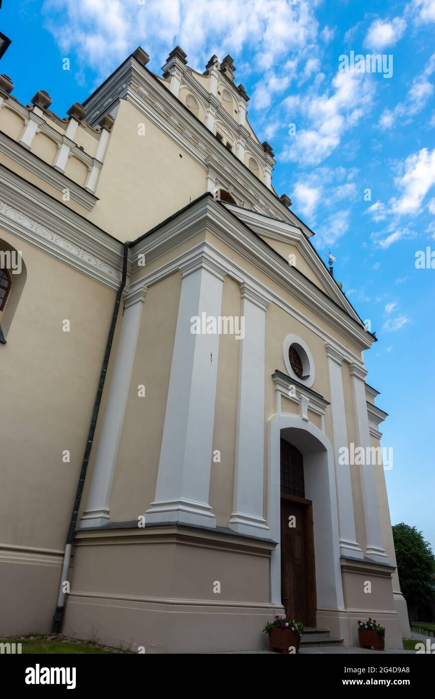The facade of the Catholic church against the blue sky. Photo taken in ...