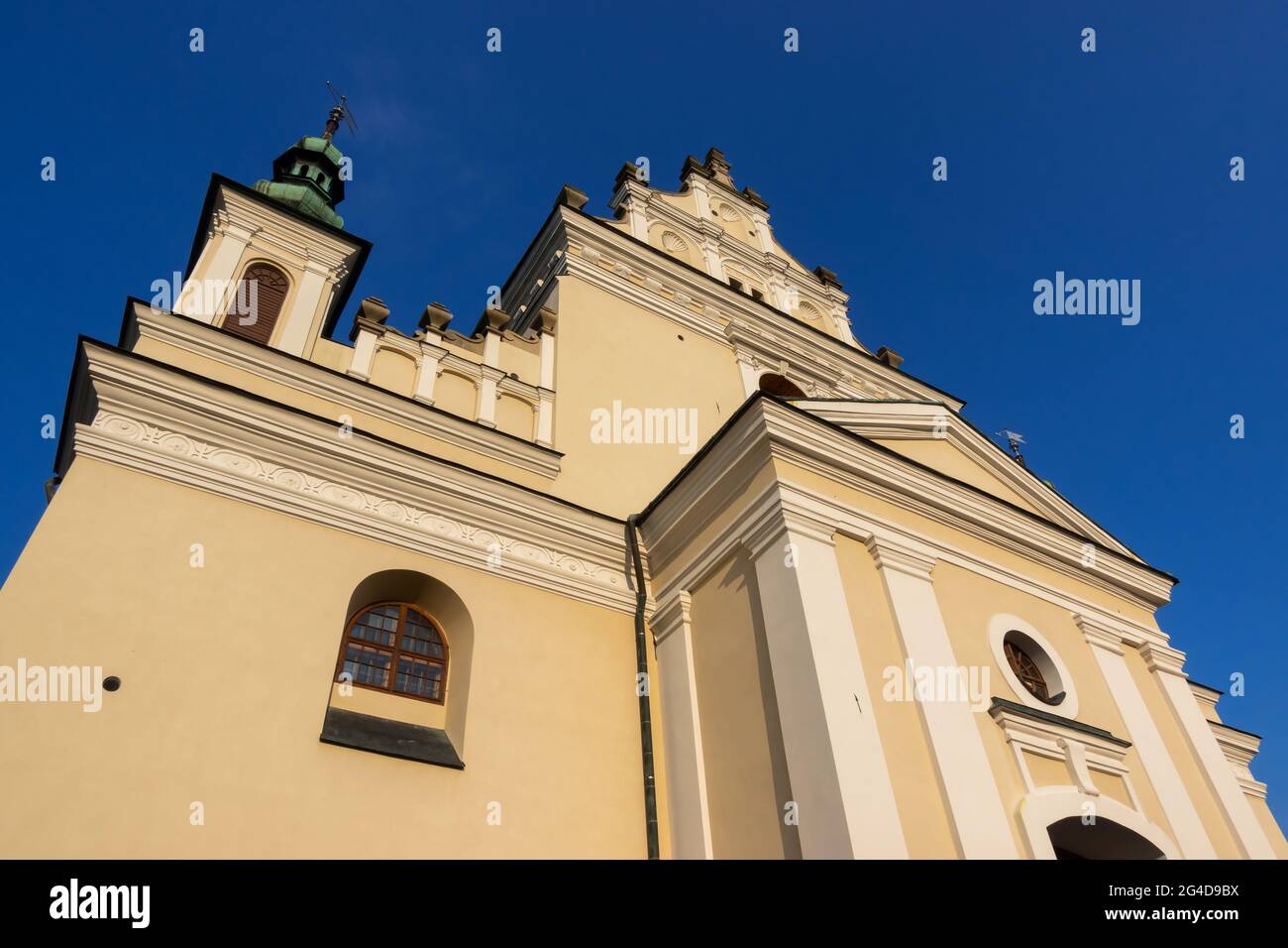 The facade of the Catholic church against the blue sky. Photo taken in ...