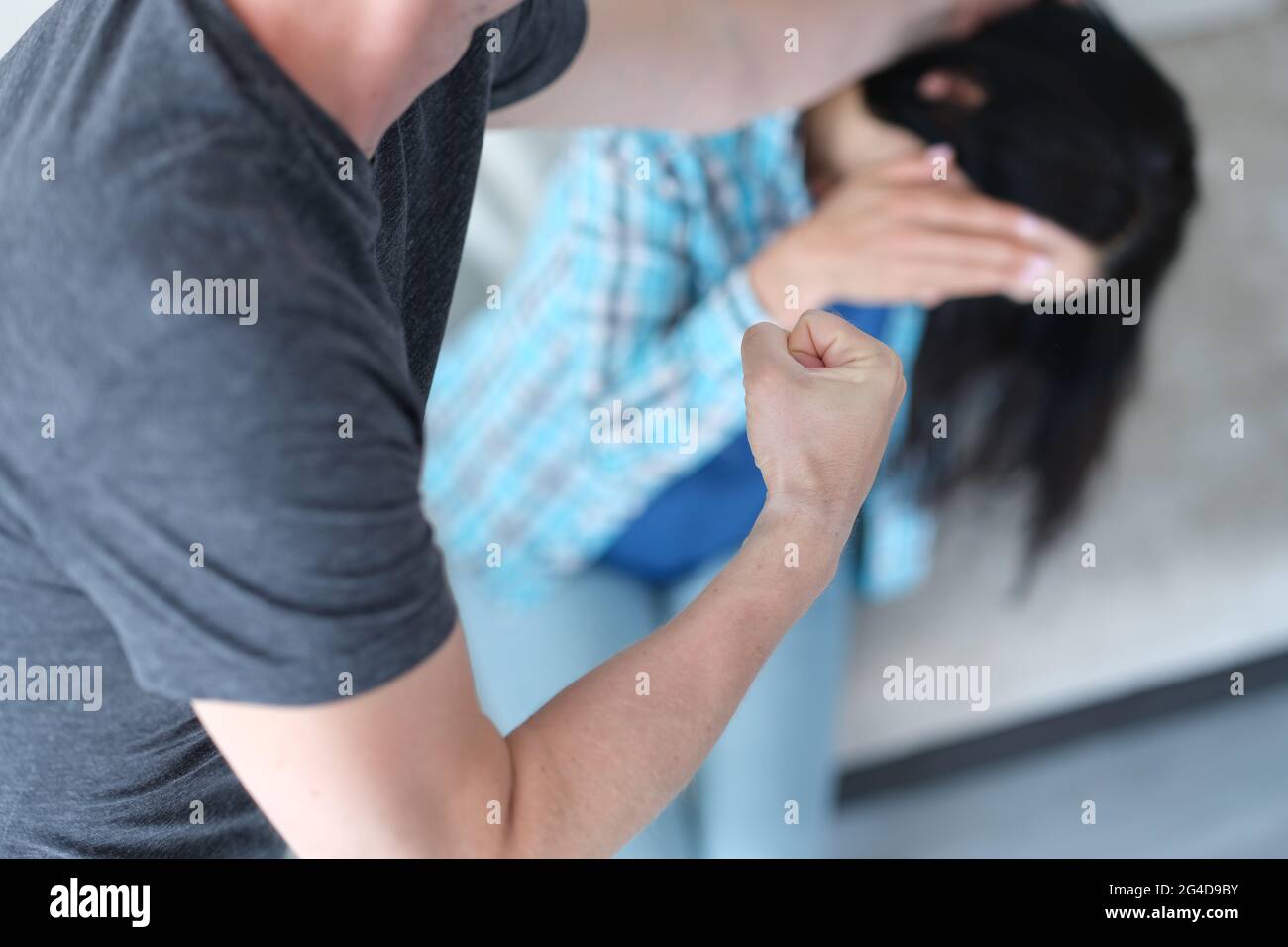 Angry aggressive man punches woman at home closeup Stock Photo - Alamy