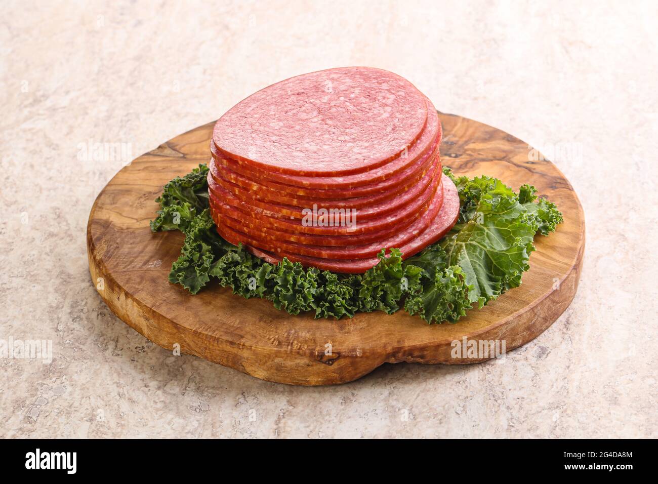 Sliced salami pork sausage snack over board Stock Photo - Alamy