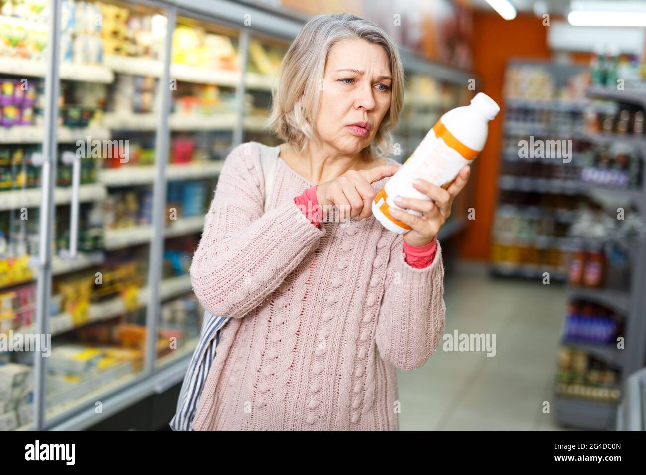 Shocked woman shopping in grocery Stock Photo - Alamy