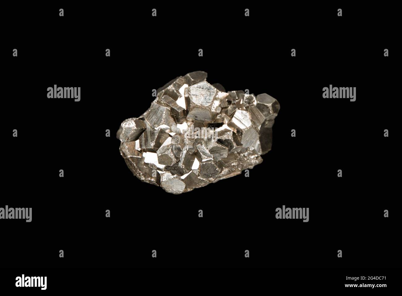Pyrite gemstone isolated on a black background Stock Photo - Alamy