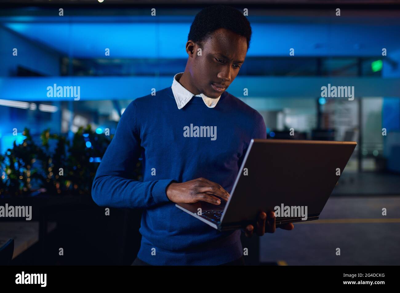One manager works on laptop in night office Stock Photo - Alamy