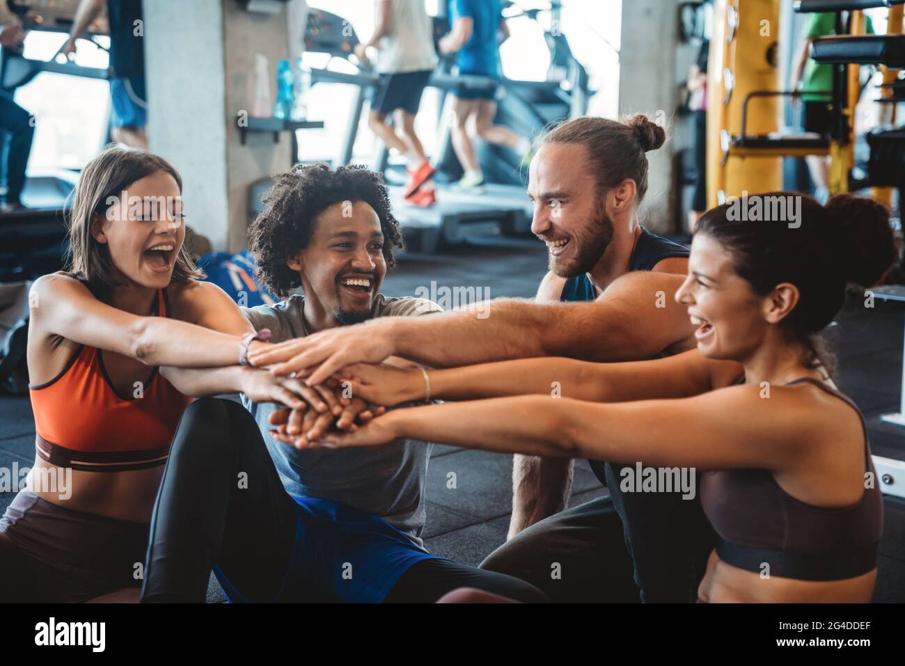 Happy diverse people exercise together in gym to stay healthy Stock ...
