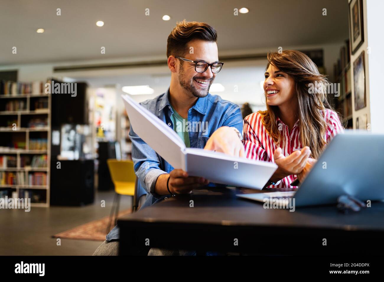 Group of college students studying in the school library Stock Photo ...