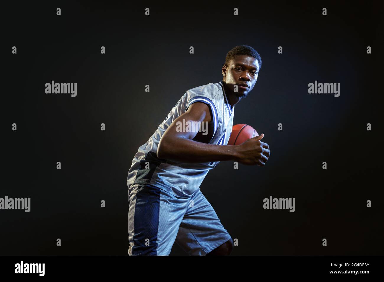 Black male in studio basketball hi-res stock photography and images - Alamy