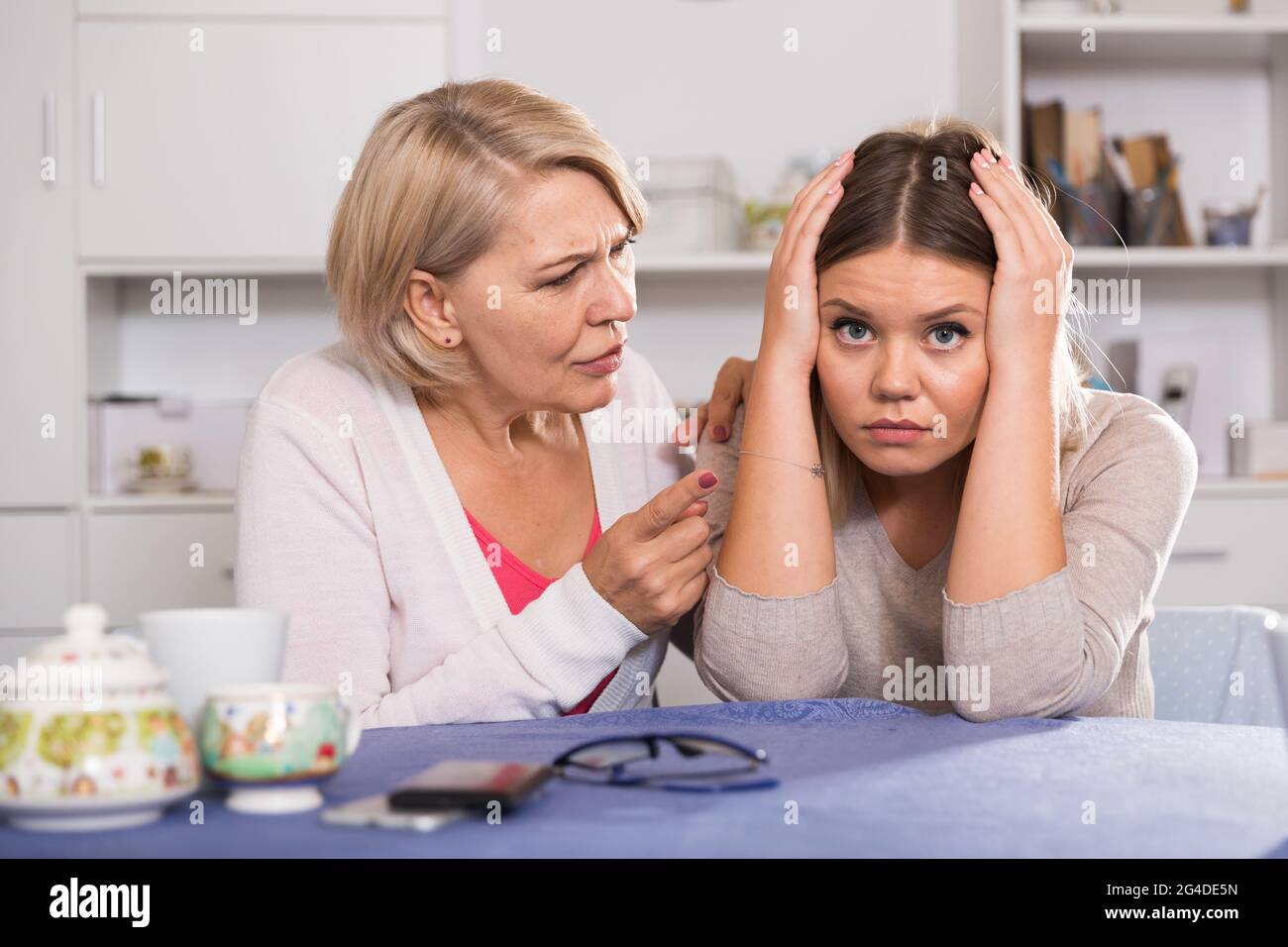 Mother scolds her adult daughter Stock Photo - Alamy