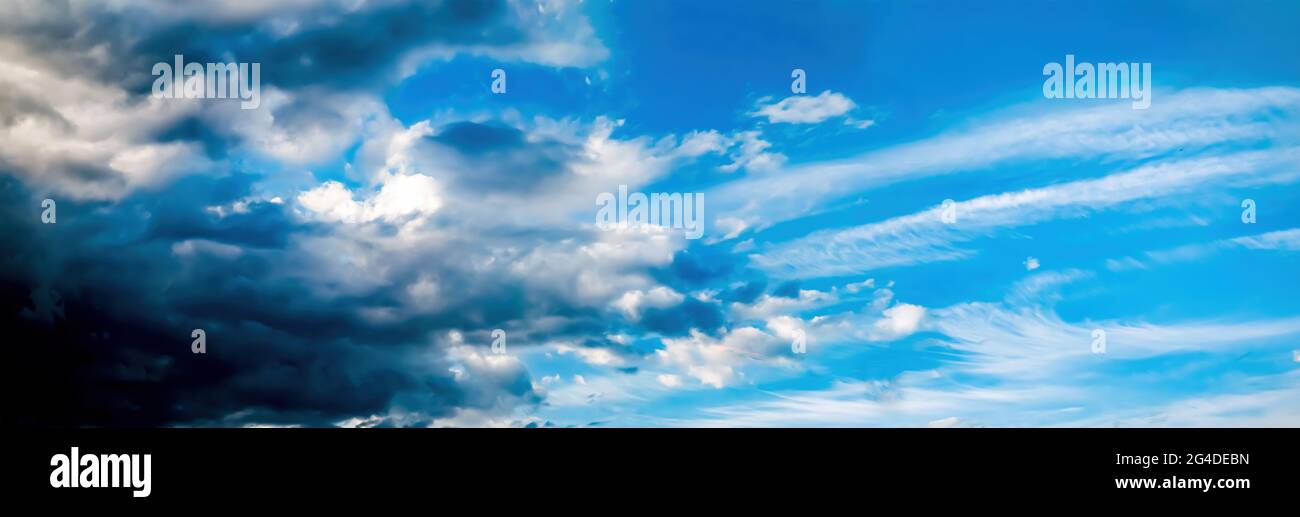 Thundercloud against a blue sky with white clouds. Cloudy blue sky ...
