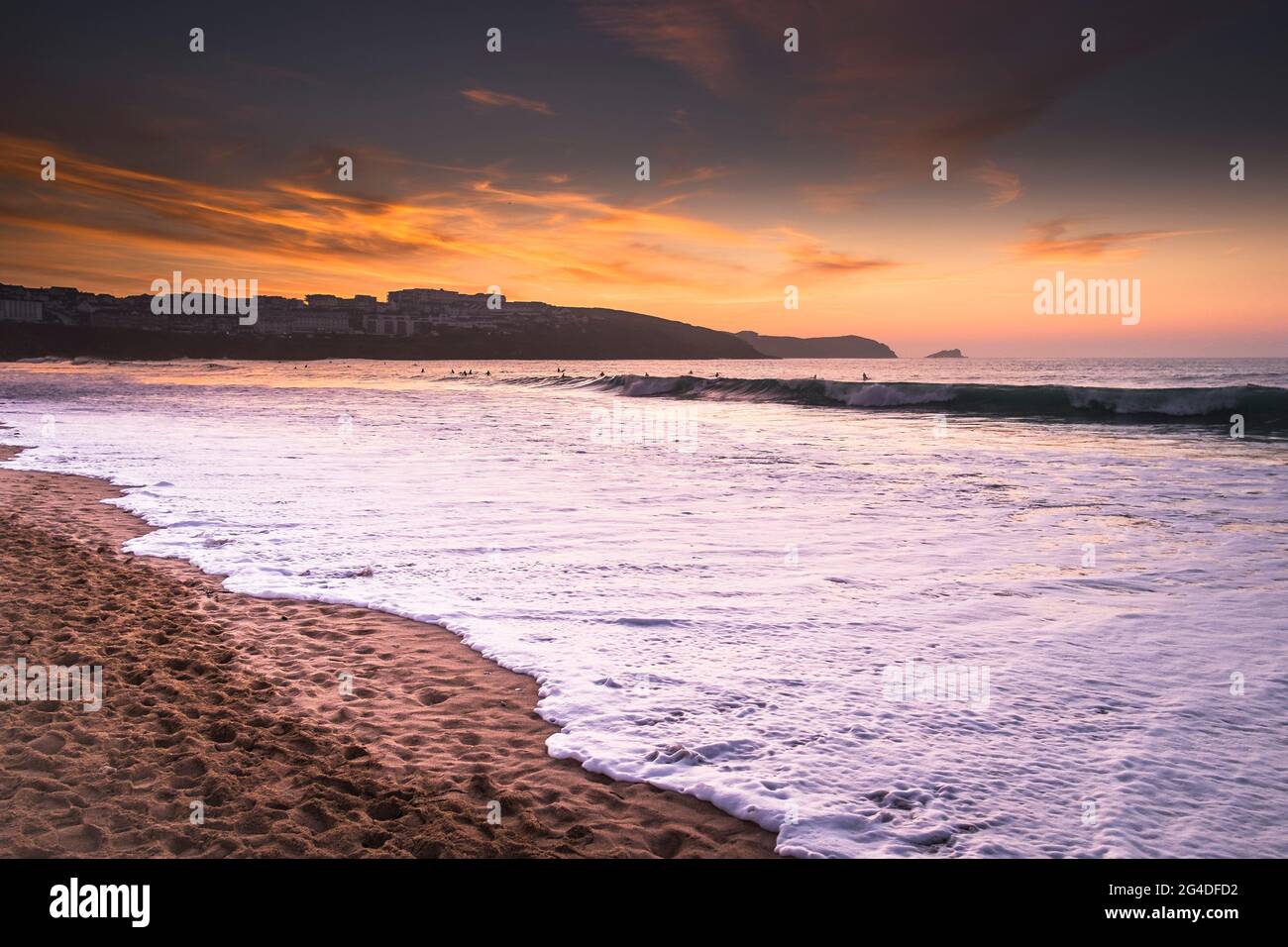 A golden sunset over Fistral Beach in Newquay in Cornwall Stock Photo ...