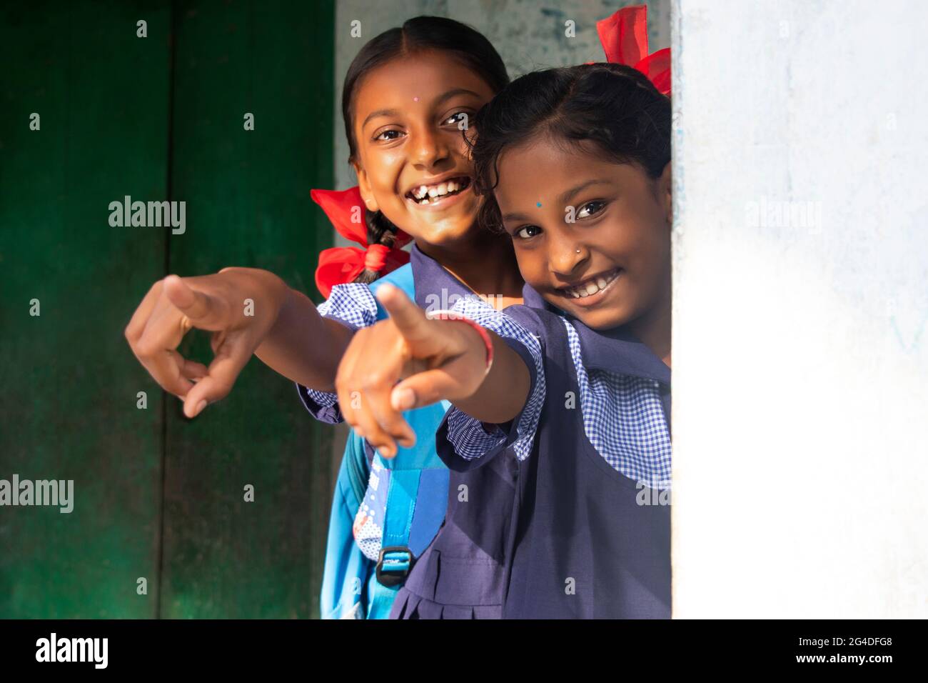 Indian girls pointing hi-res stock photography and images - Alamy