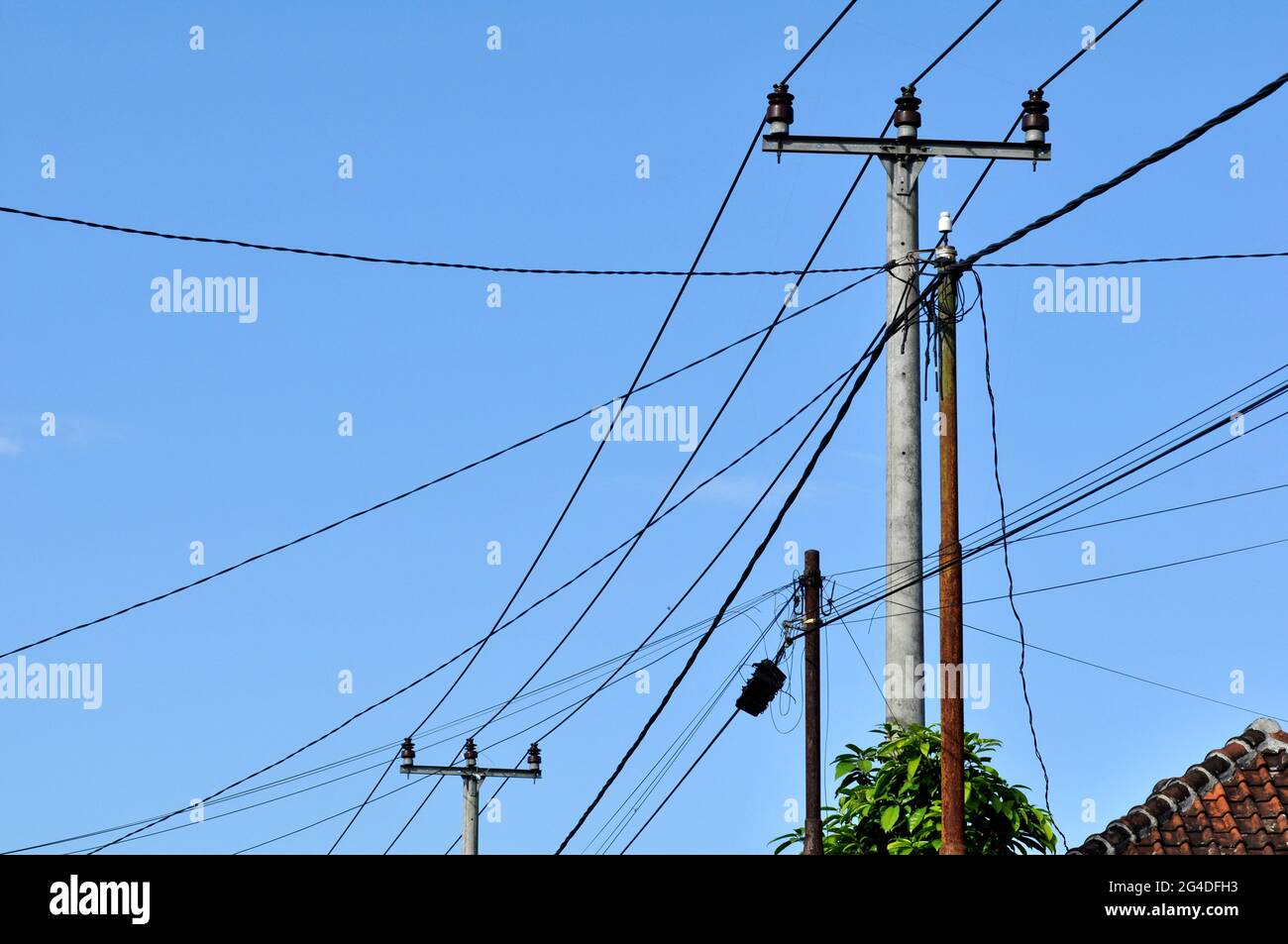 Electric cables and poles in residential areas of West Java, Indonesia ...