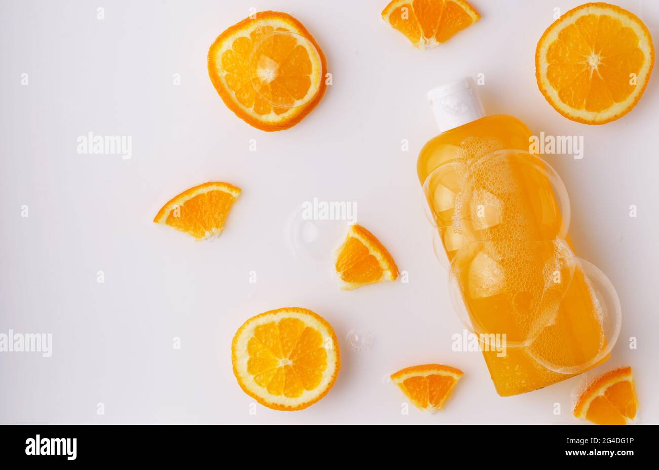 Shampoo, shower gel, orange liquid soap with natural ingredients in a ...