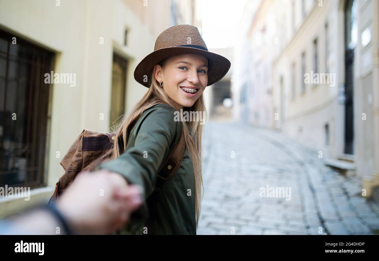 Young couple travelers in love sightseeing in city on holiday, having ...
