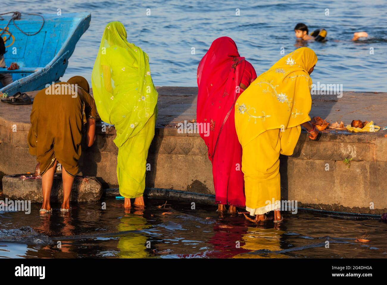 Women doing morning pooja Stock Photo - Alamy