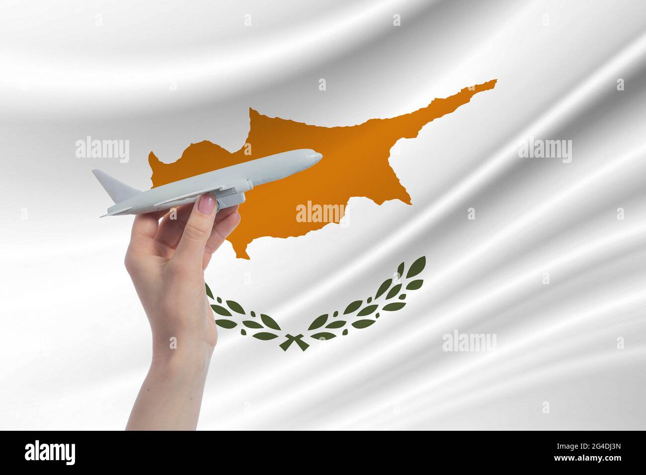 Airplane in hand with national flag of Cyprus Travel to Cyprus Stock ...