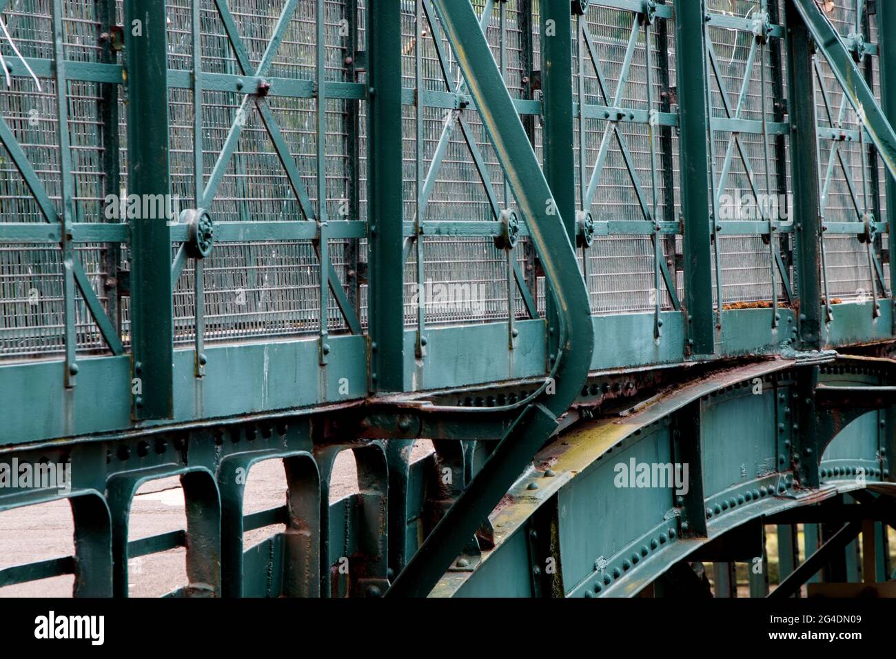 Old metal bridge spanning a river detail Stock Photo - Alamy