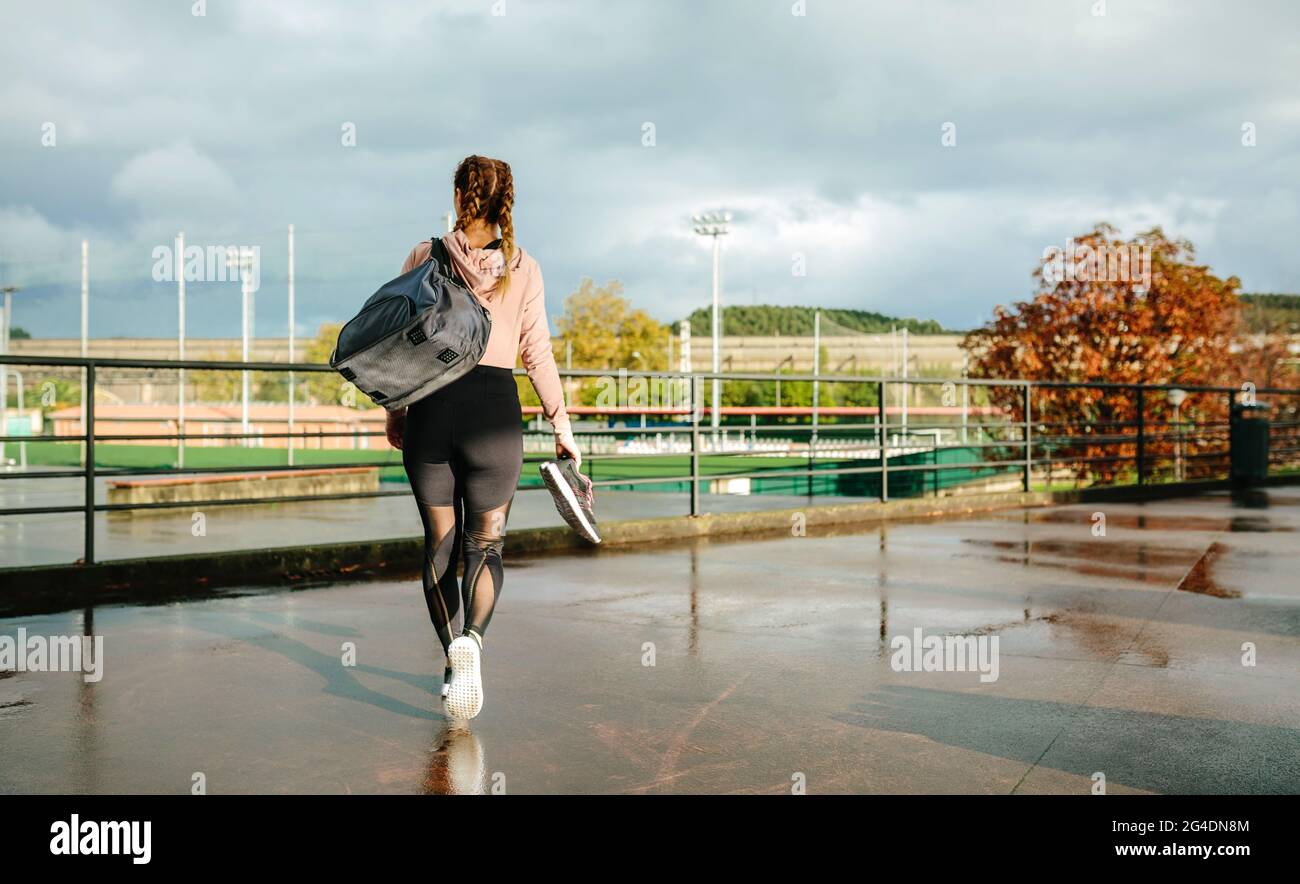 Girl from behind bag hi-res stock photography and images - Alamy