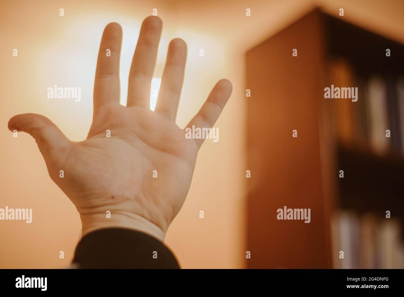 Hand reaching for light - hope concept Stock Photo - Alamy