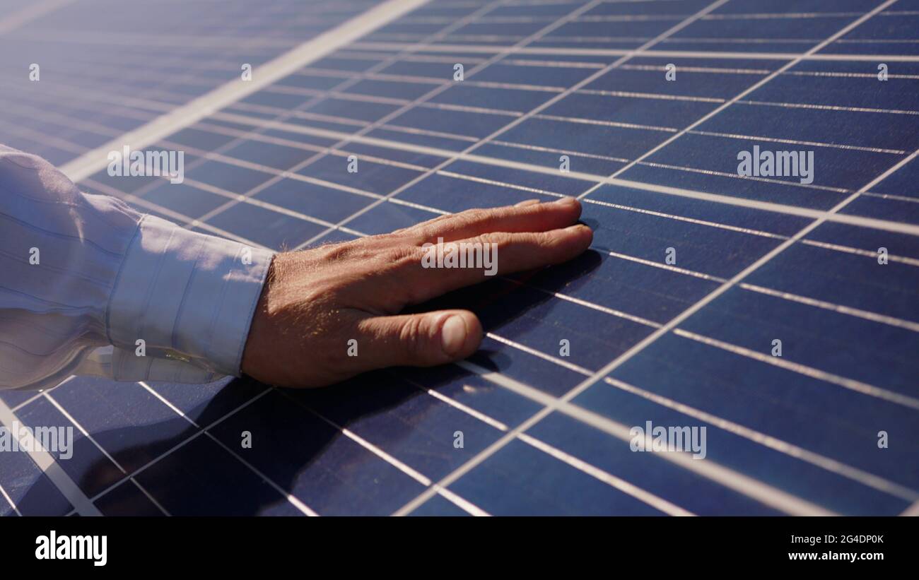Close up of a young engineer hand is checking the operation of sun and ...