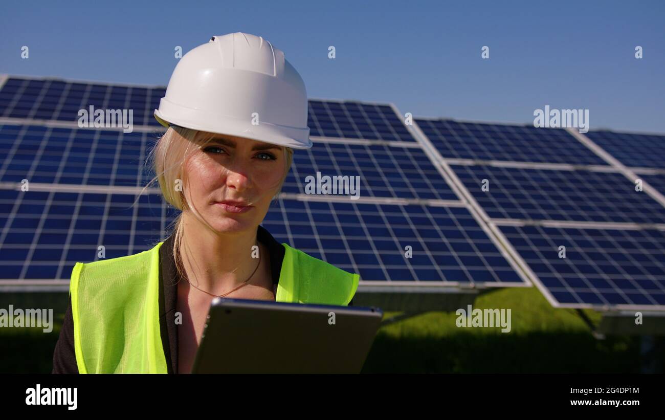 Female ecological engineer uses digital tablet and collects efficient ...