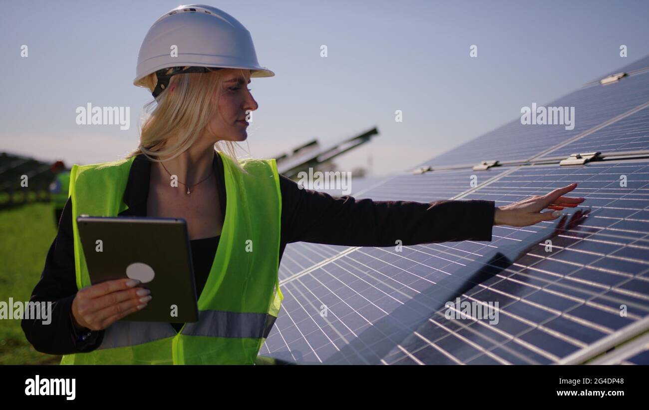 Female ecological engineer uses digital tablet and collects efficient ...