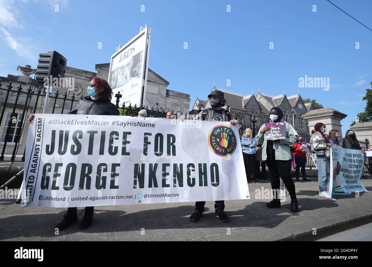 Protesters outside the RDS in Dublin as the inquest opens for George ...