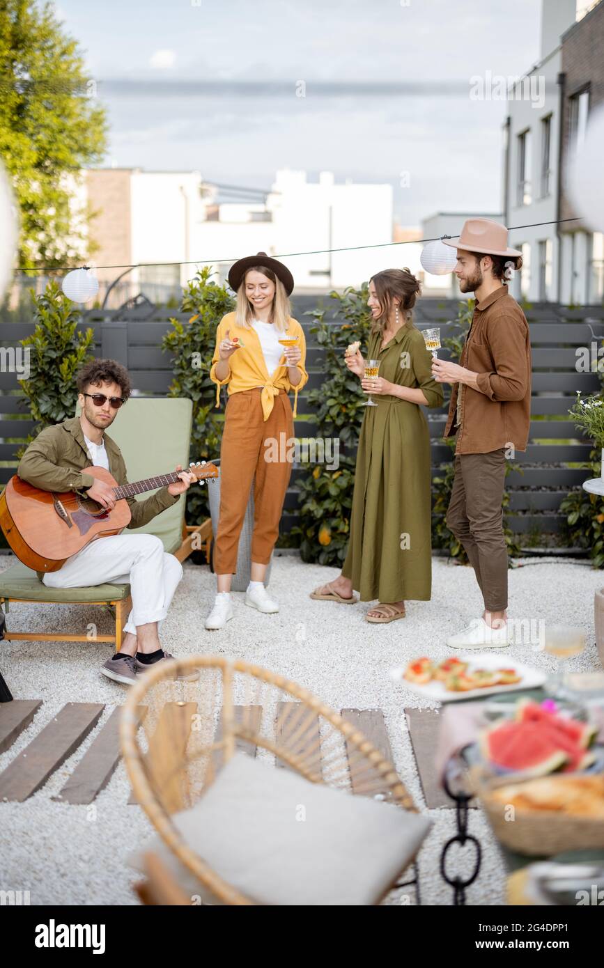 Friends having fun on a beautiful backyard Stock Photo - Alamy
