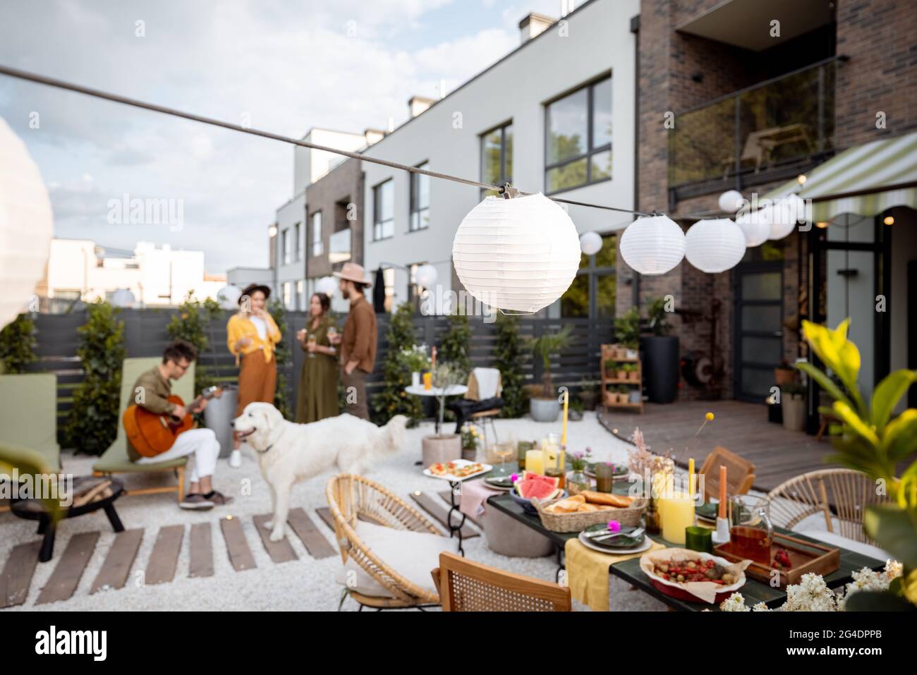 Friends having fun on a beautiful backyard Stock Photo - Alamy